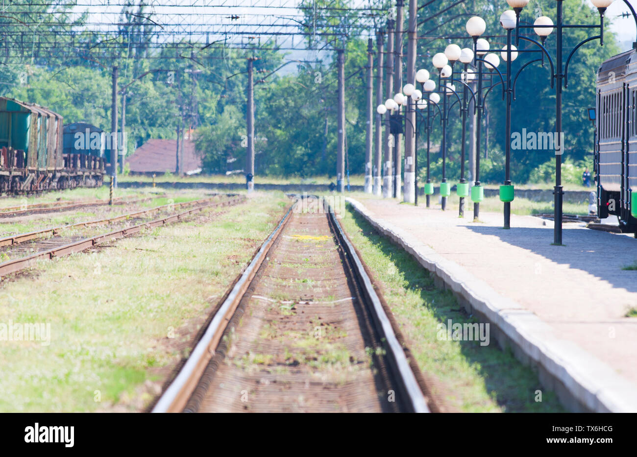 railway tracks a train station in day. Ukraine Stock Photo - Alamy