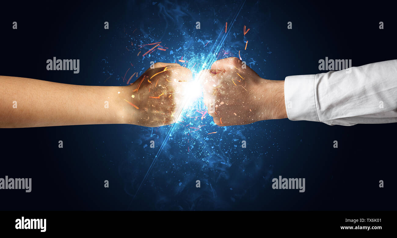 Two hands fighting with light, glow, spark and smoke concept Stock ...