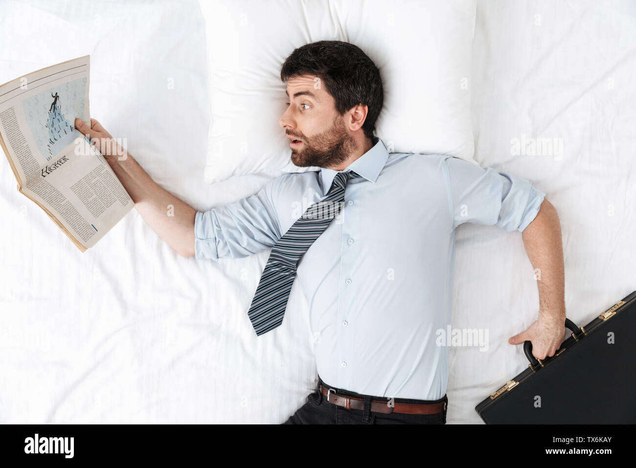 Young man sleeping newspaper hi-res stock photography and images - Alamy