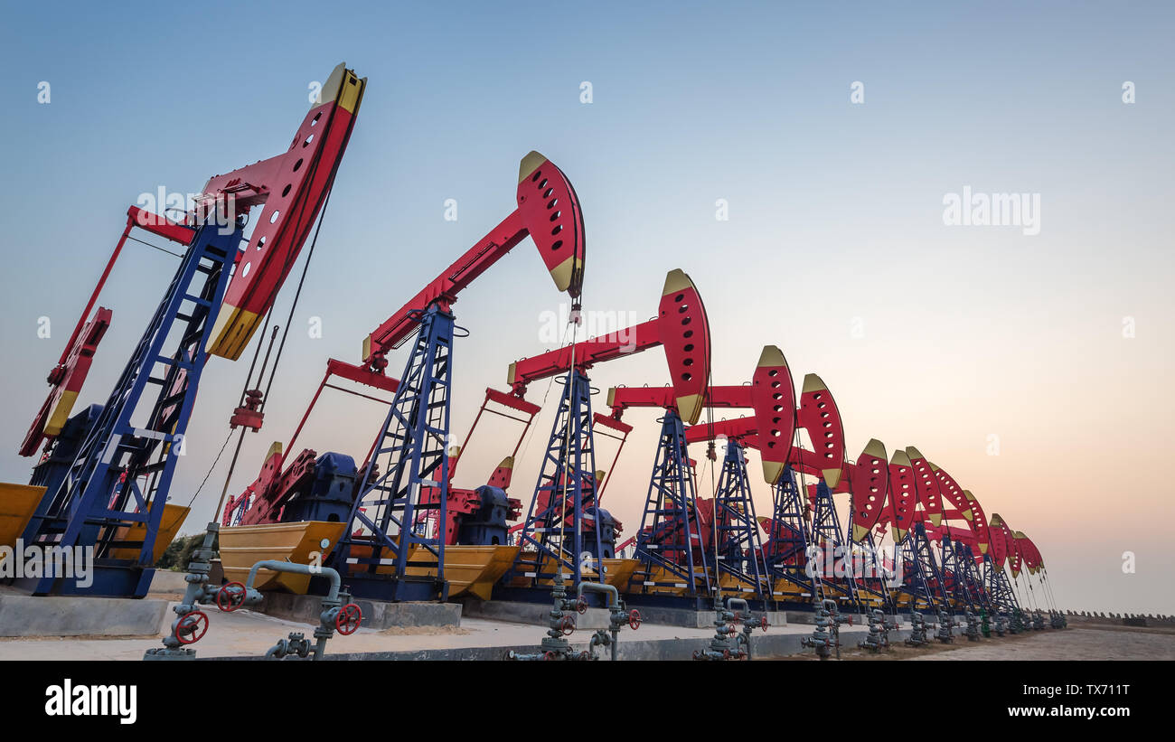working oil-rig of oilfield day and night Stock Photo - Alamy