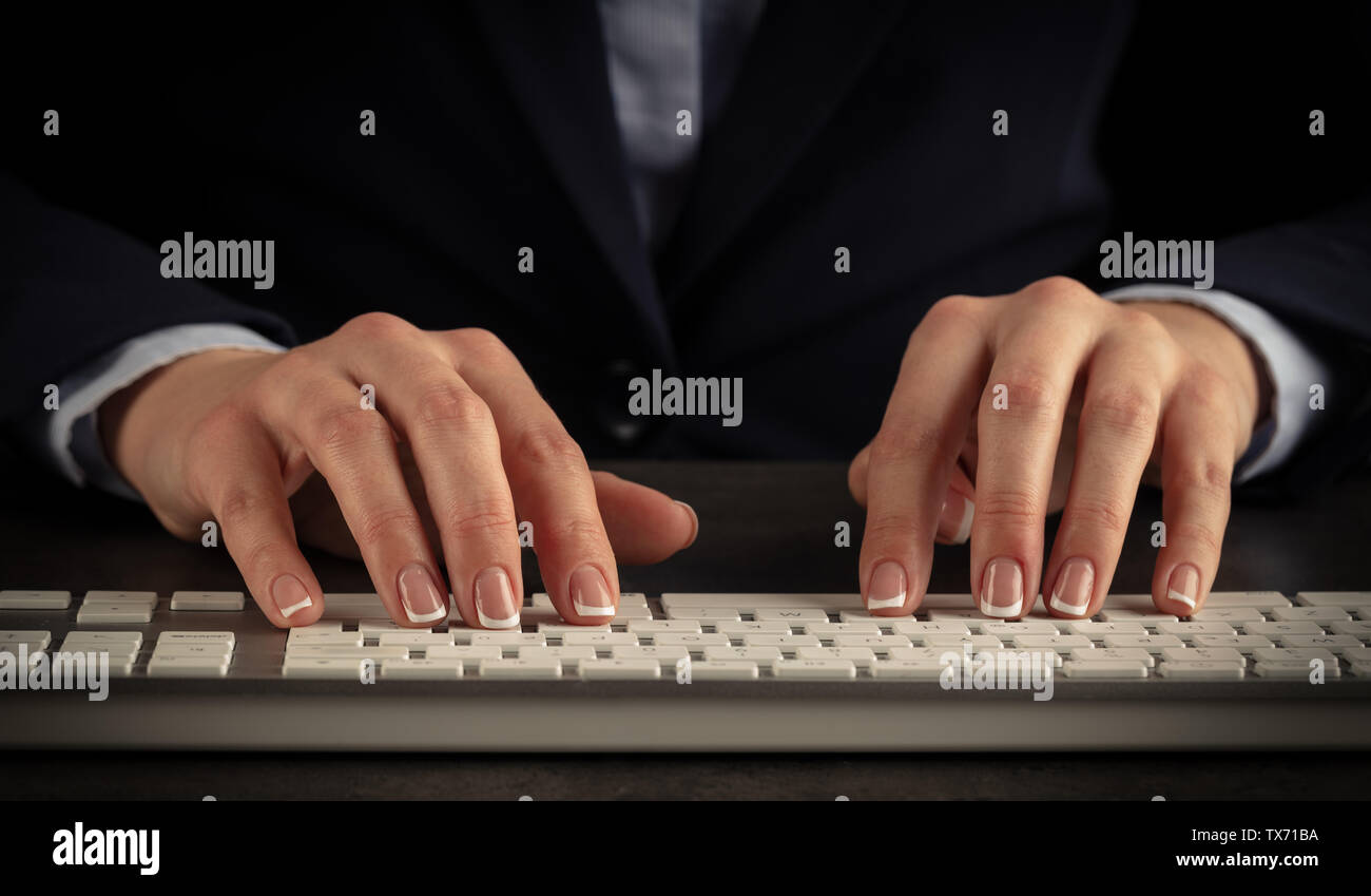 Business woman typing on keyboard Stock Photo - Alamy