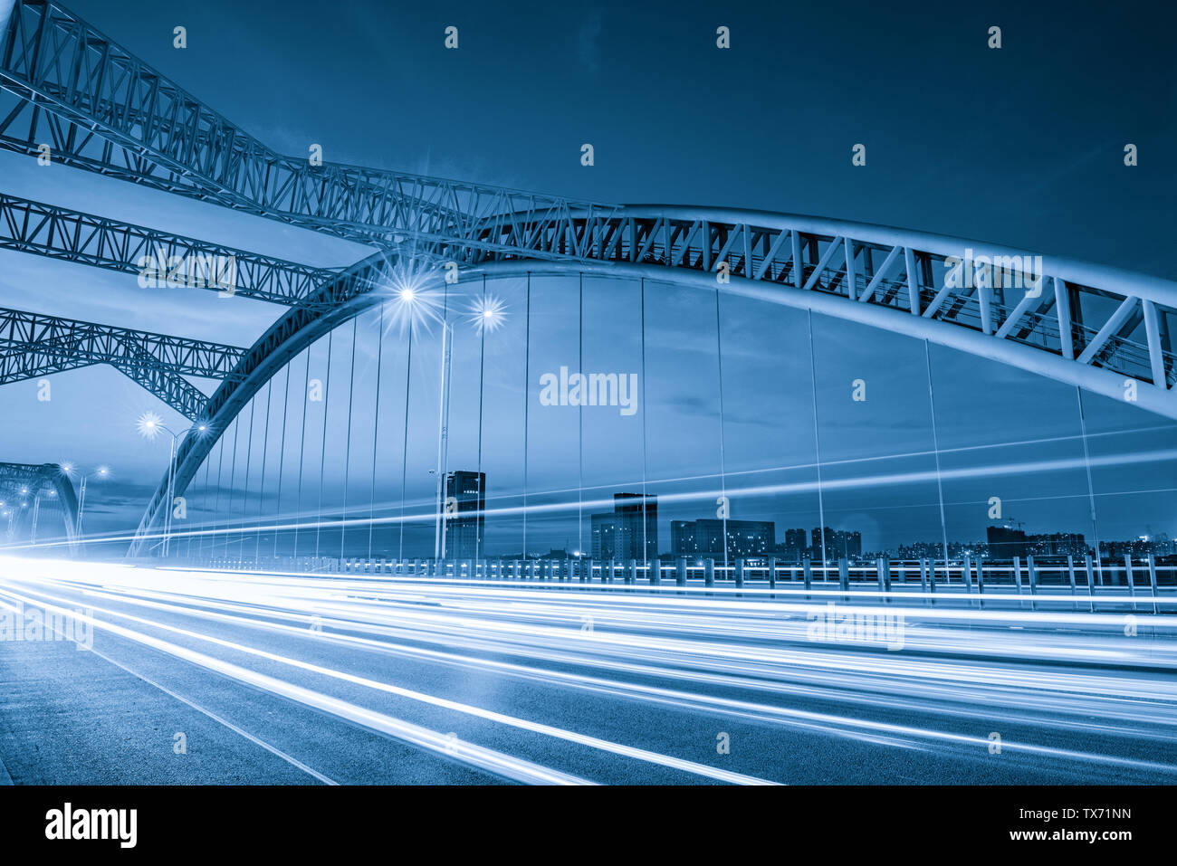 Night view of Hyundai Bridge, car driving on road in sunset Stock Photo ...