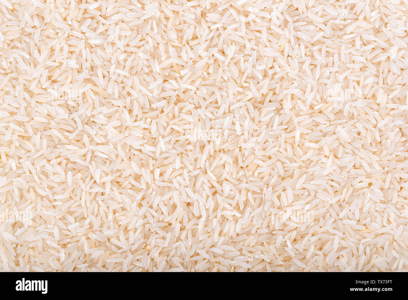 Pile of white rice background Stock Photo - Alamy