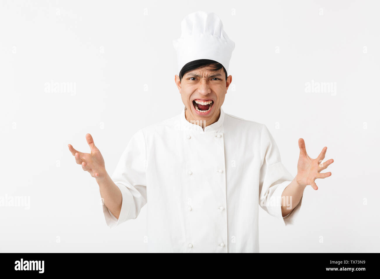 Image of asian angry man in white cook uniform and chef's hat screaming ...