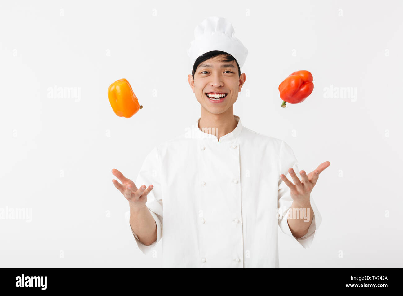 Image of professional chinese chief man in white cook uniform smiling ...