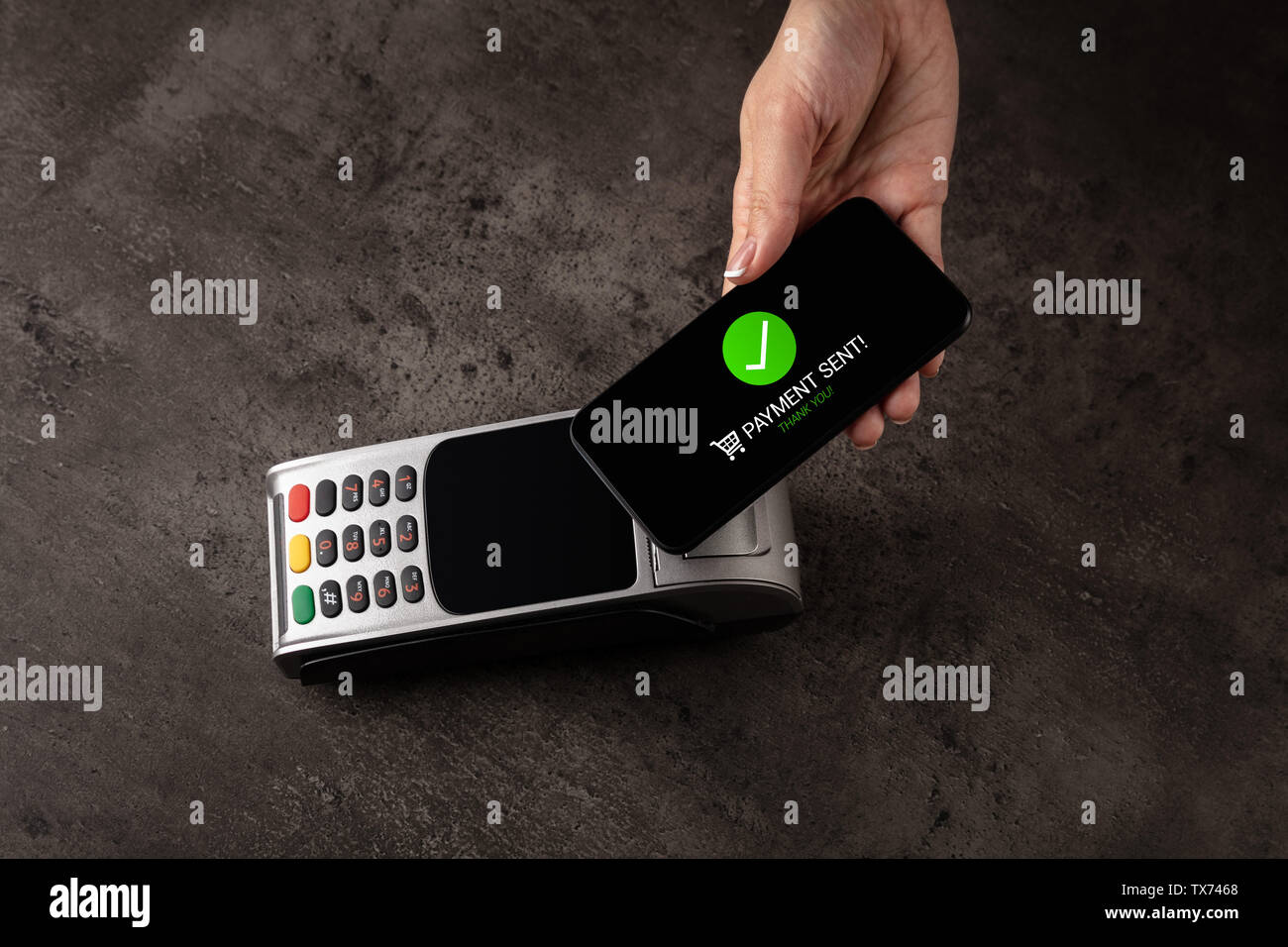 Mobile payment accepted on terminal Stock Photo - Alamy
