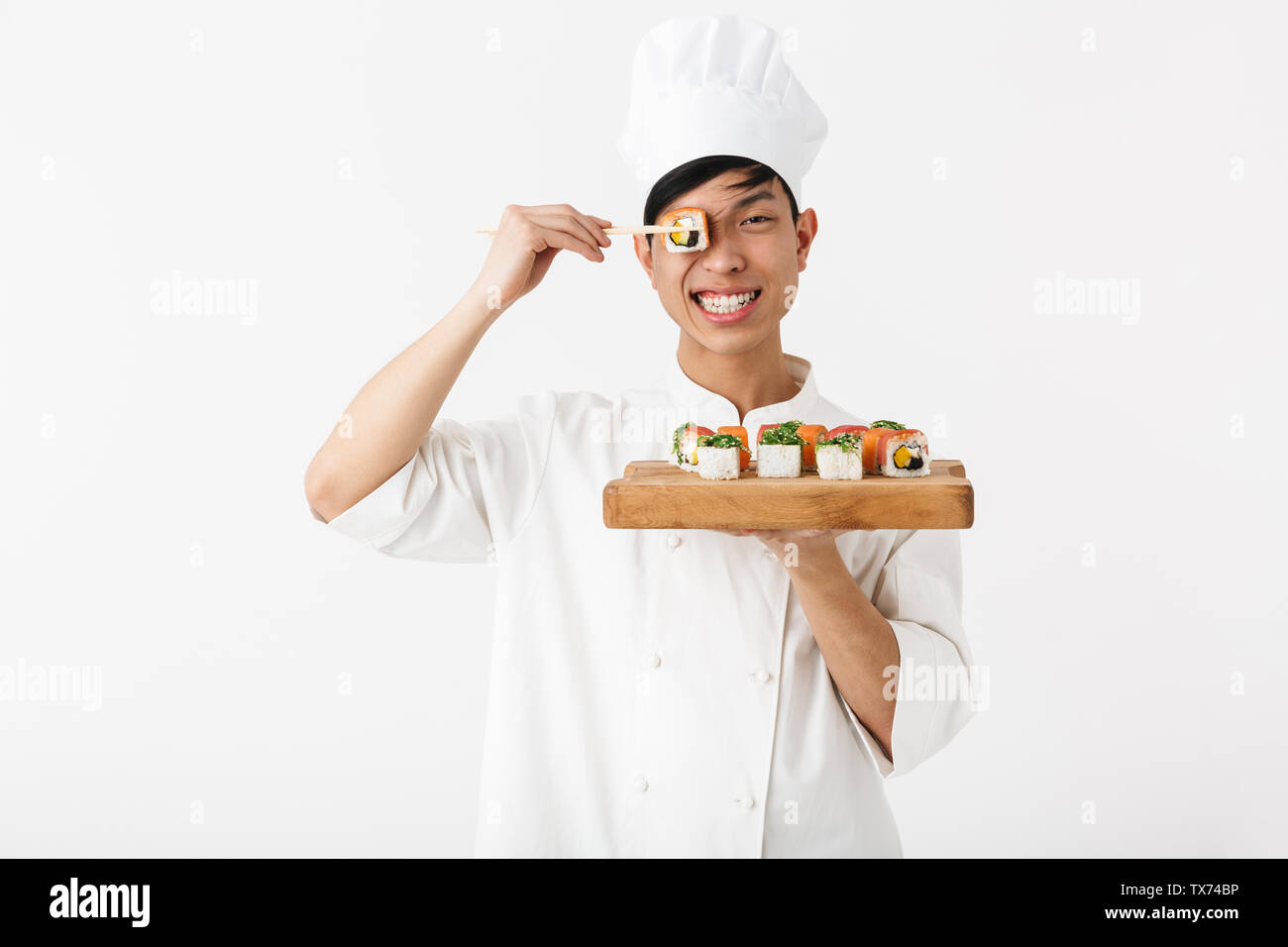 Image of smiling chinese chief man in white cook uniform holding plate ...