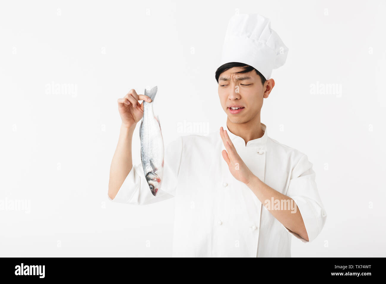 Image of serious japanese chief man in white cook uniform and hat ...