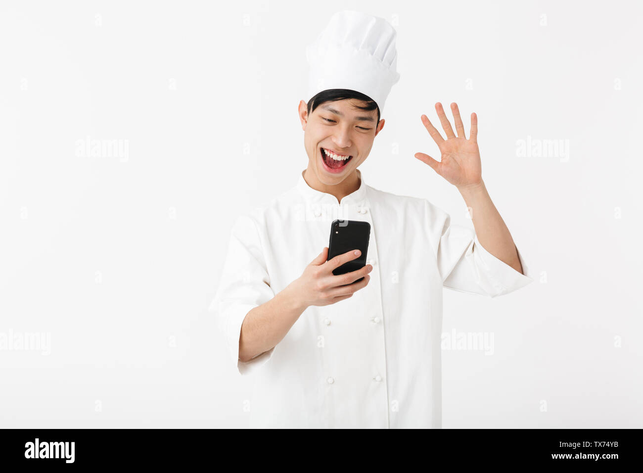 Photo of asian chief man in white cook uniform and chef's hat holding ...