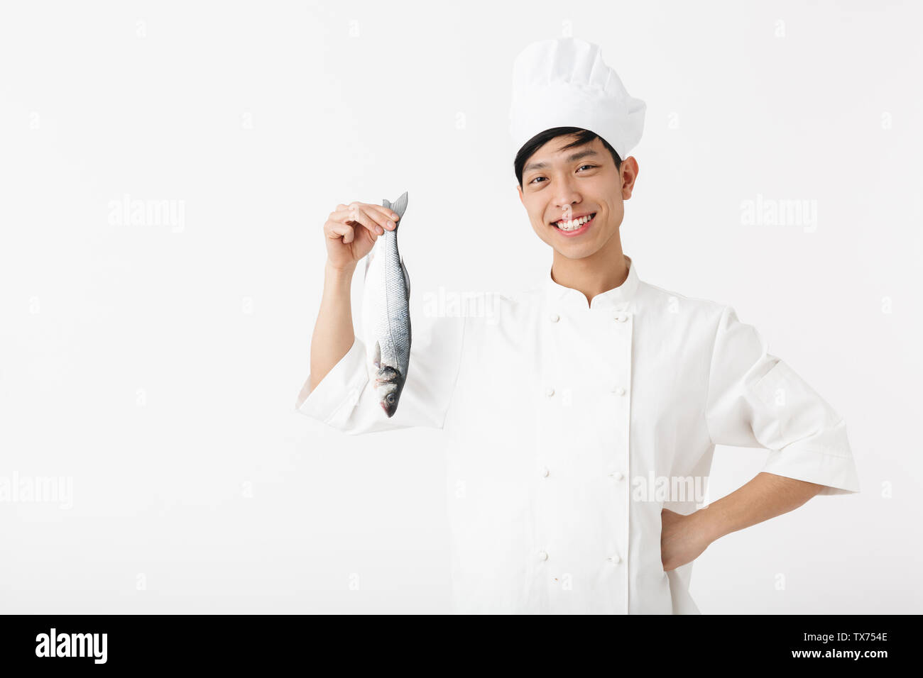 Image of pleased japanese chief man in white cook uniform and hat ...