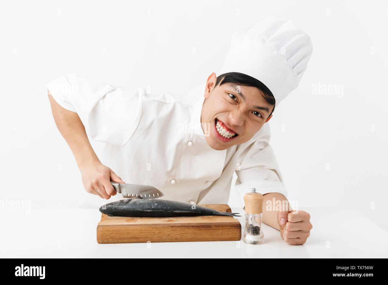 Image of young japanese chief man in white cook uniform cooking and ...