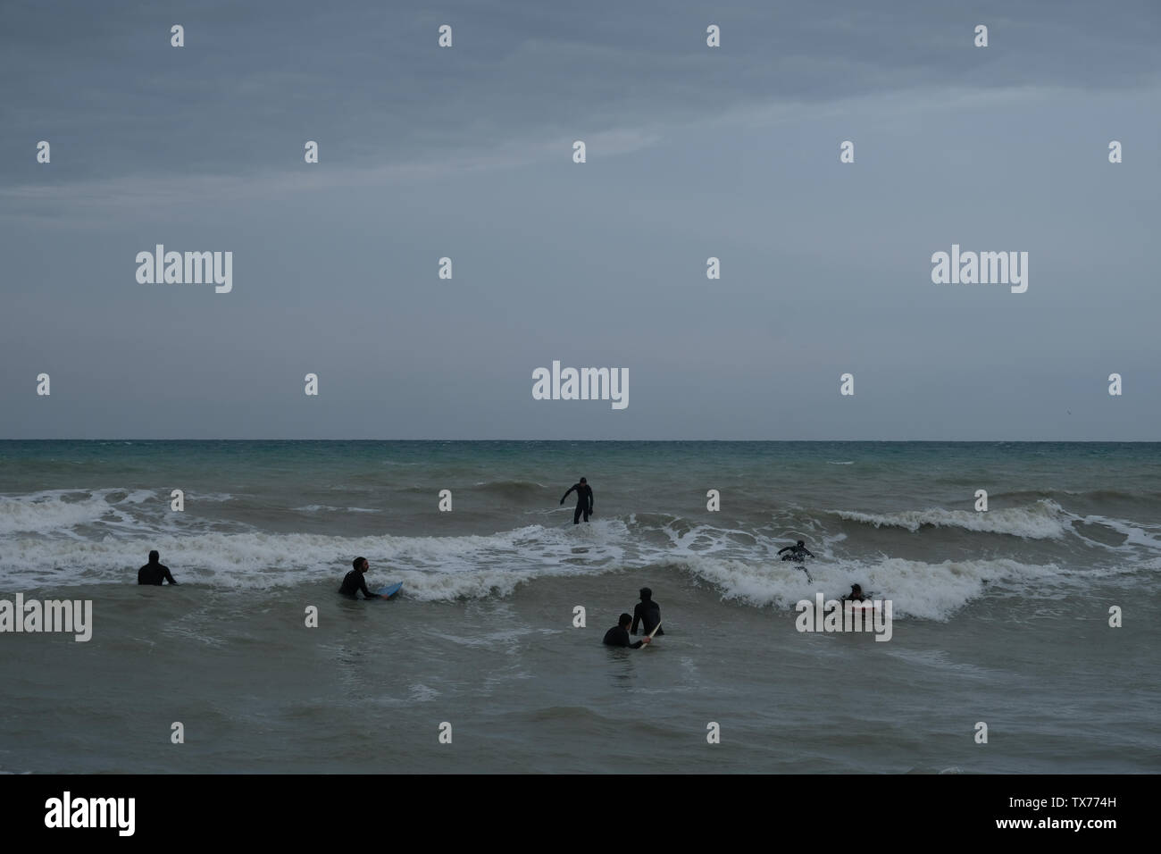 Surfers in winter in Rimini, Italy. Empty during the off season Stock ...