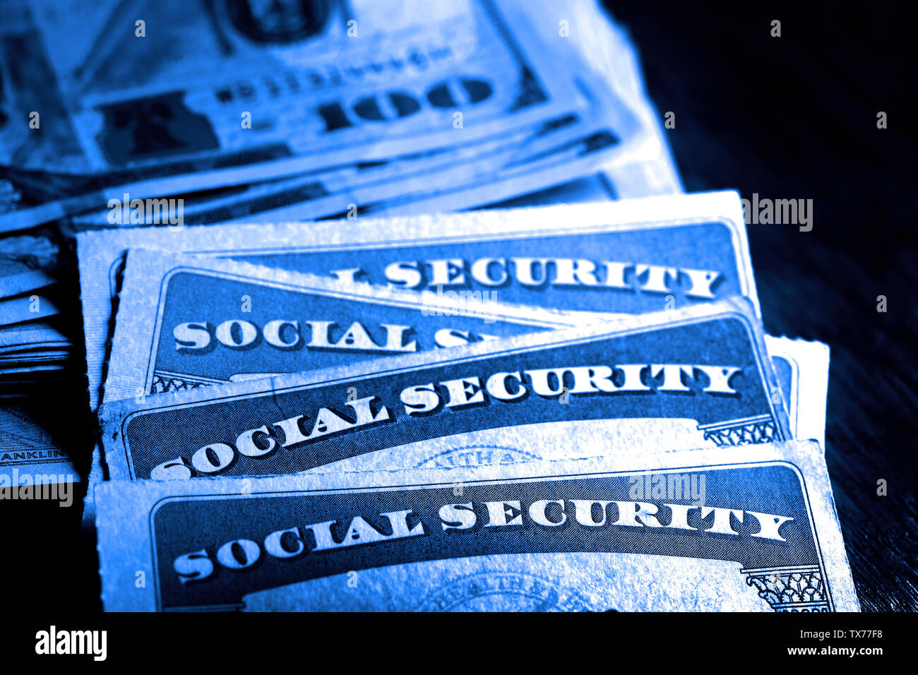 Social Security cards with cash money for savings and retirement Stock ...