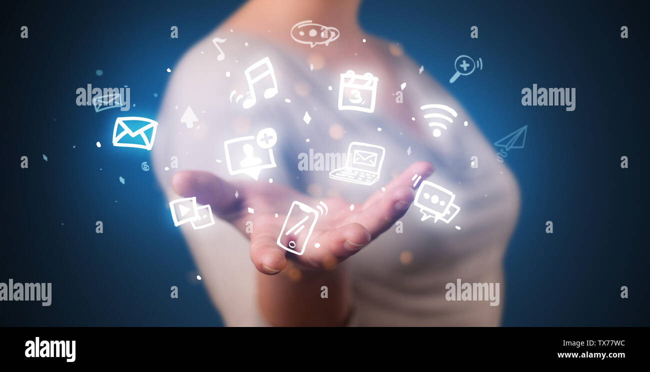 Hand holding application icons and symbols in her hand Stock Photo - Alamy