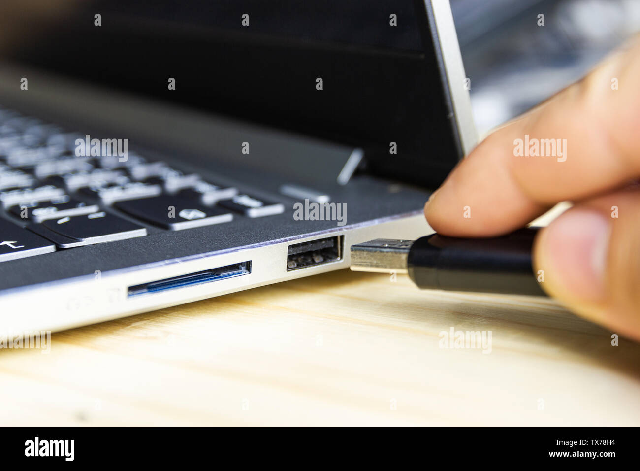 hand man hold Flash drive connect to USB port plug-in computer laptop ...