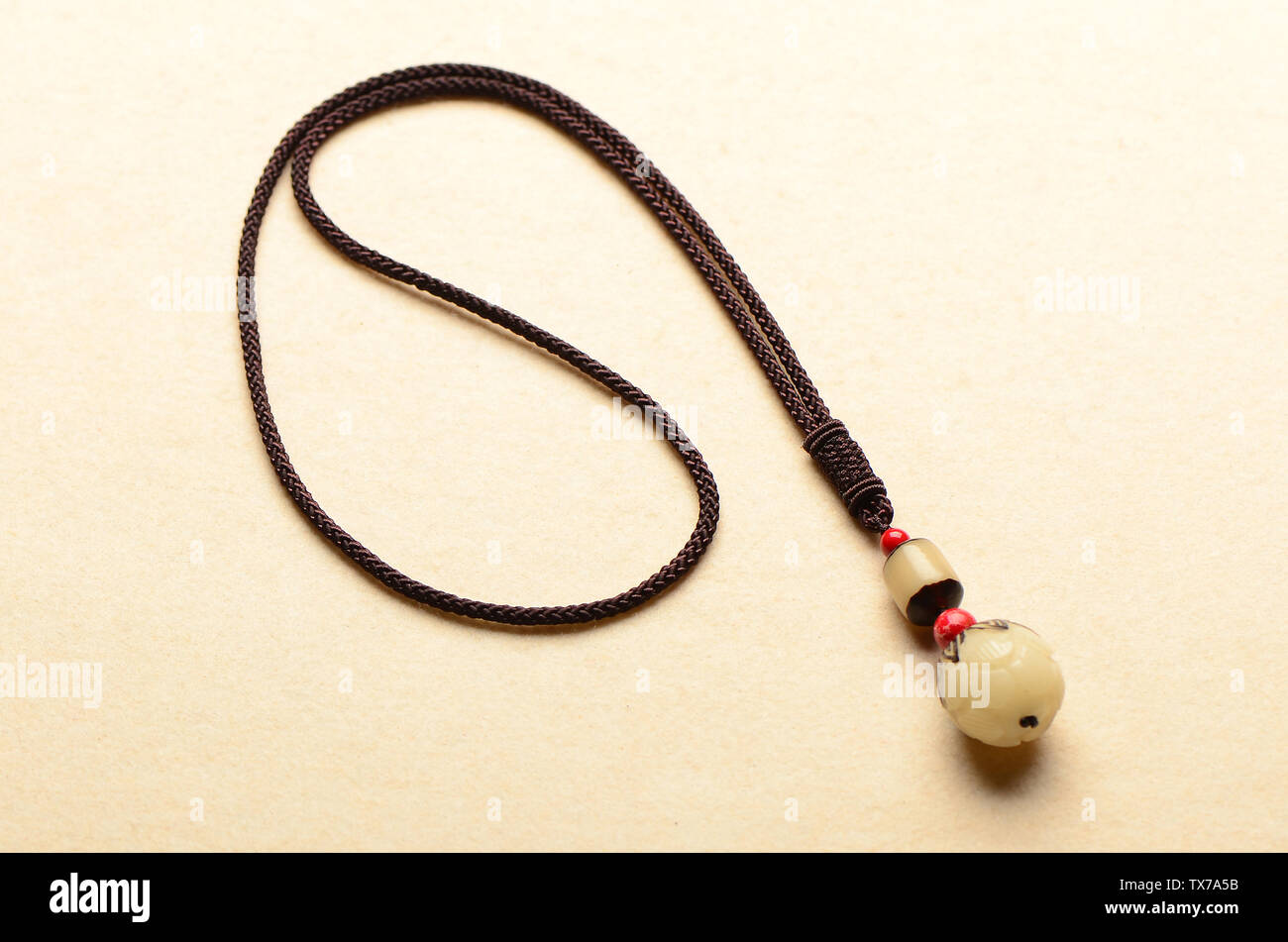 Bodhi pendant, necklace, wool chain Stock Photo - Alamy