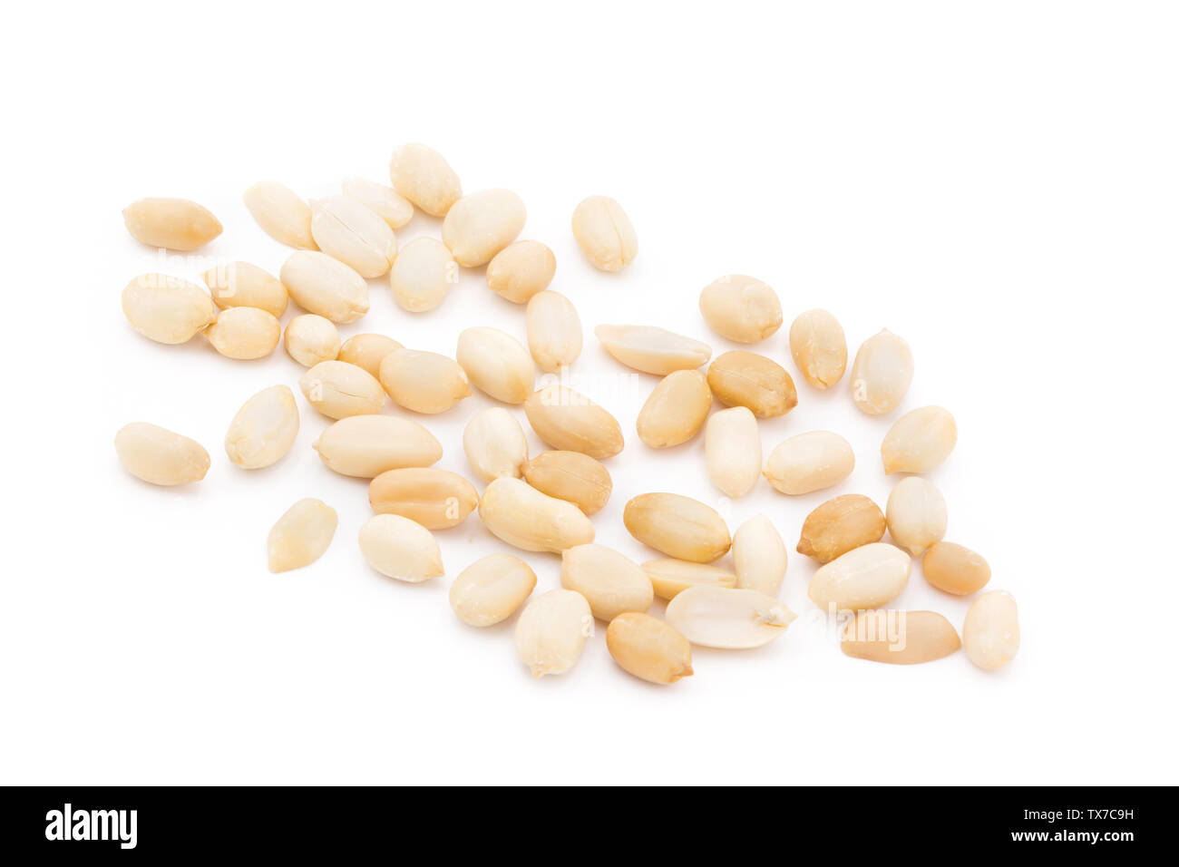 Peeling peanuts on white background Stock Photo - Alamy