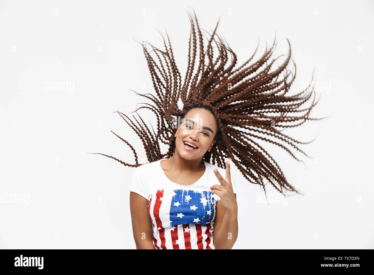Portrait of ecstatic african american woman having fun and shaking her ...