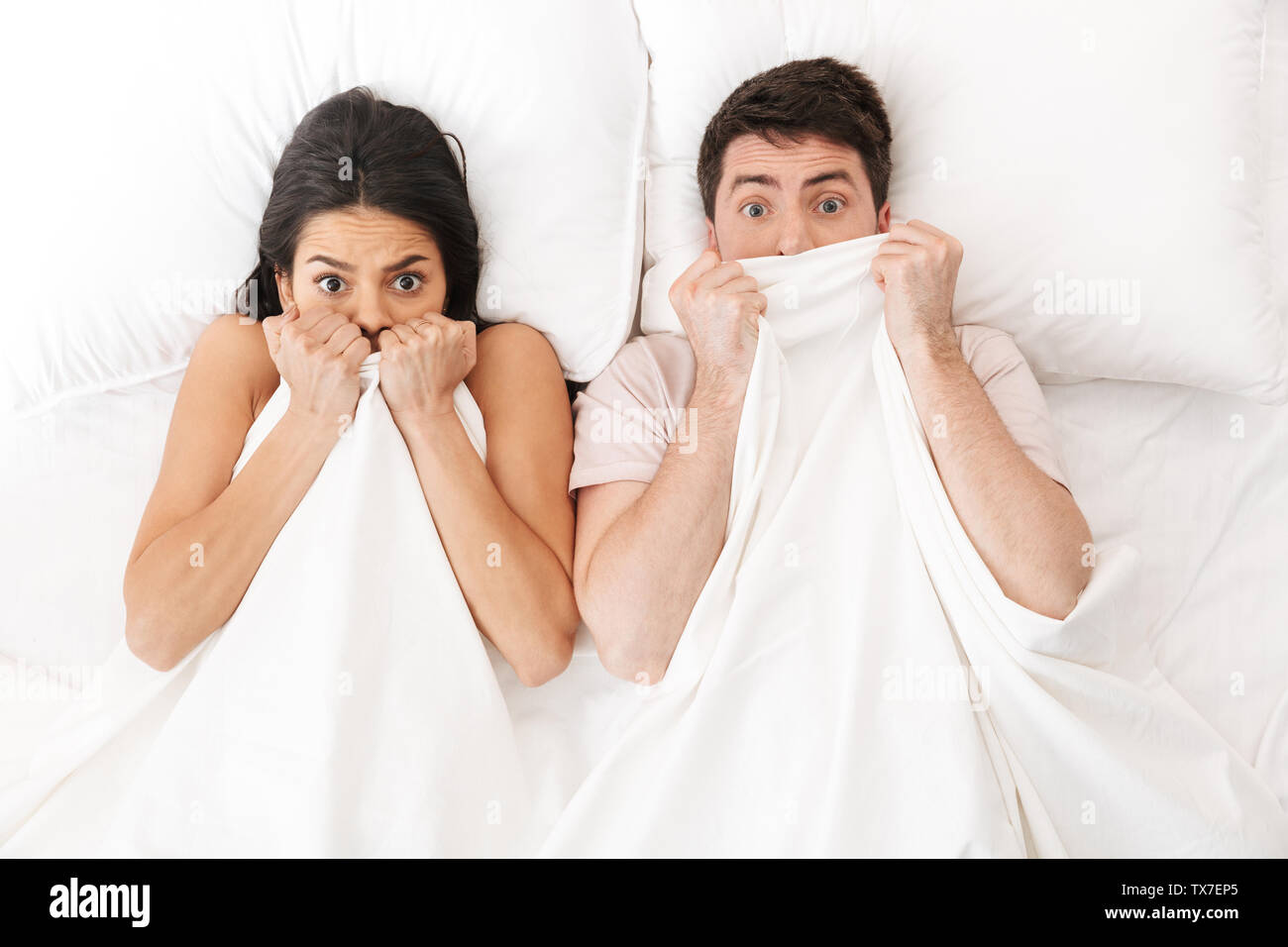 Scared couple and bed hi-res stock photography and images - Alamy