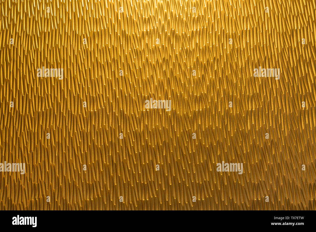 metal or plastic golden color wall background texture Stock Photo - Alamy