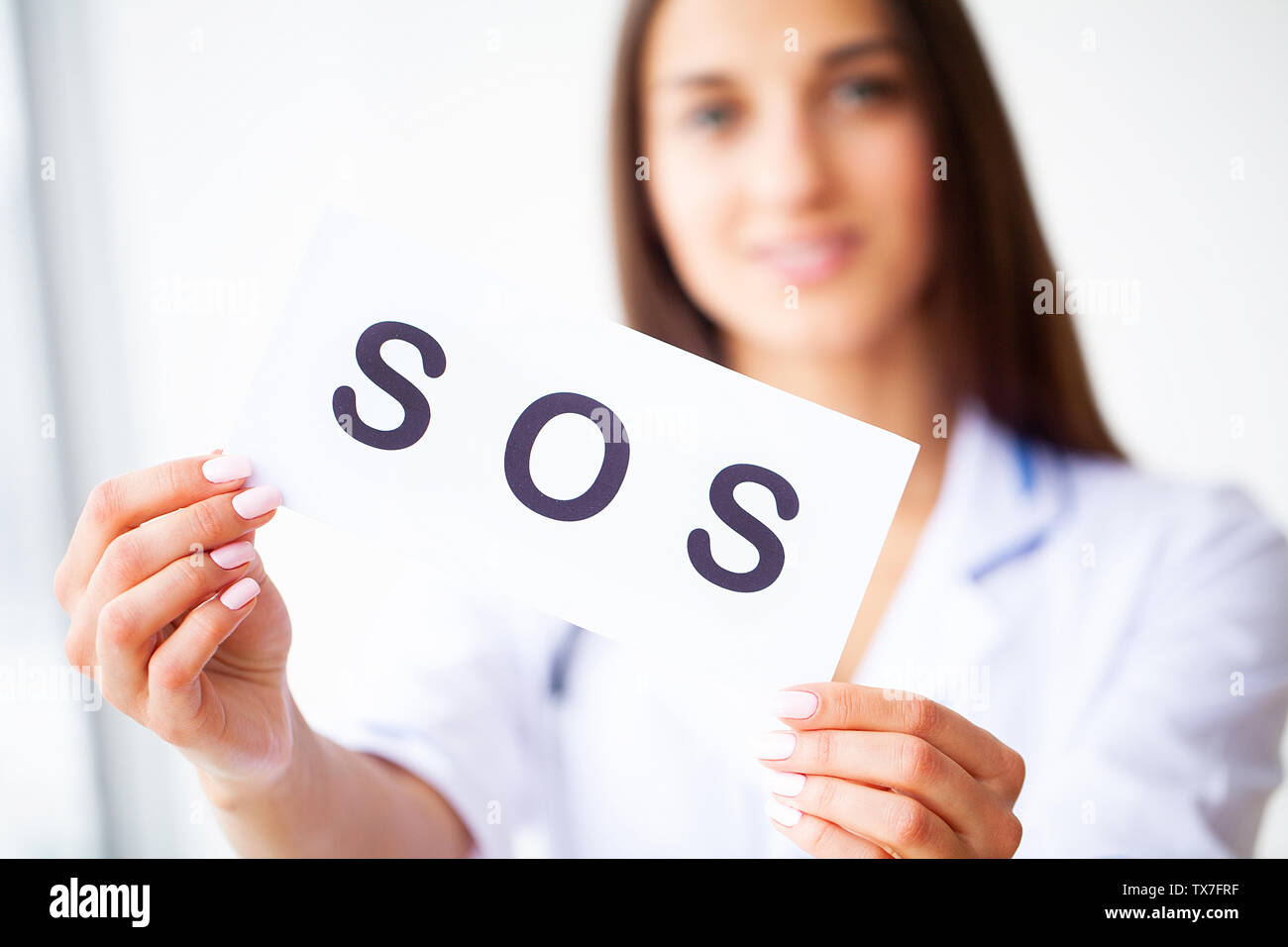 Health Care. Doctor Holding a Card With Symbol SOS, Medical Concept ...