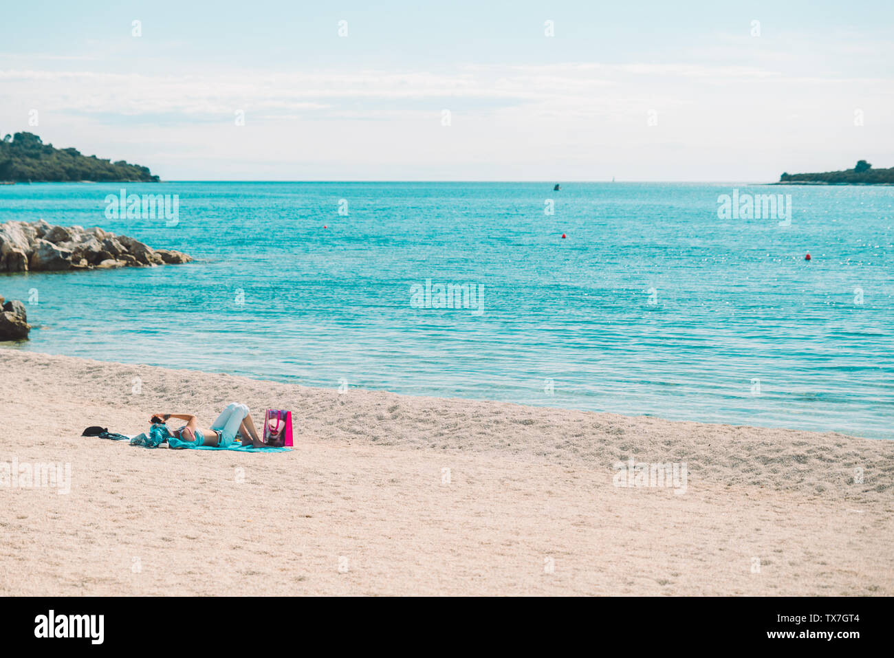 Woman laying sunbathing taking hi-res stock photography and images - Alamy