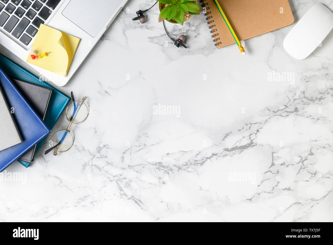 Modern marble desk table with laptop, other supplies with copy space ...