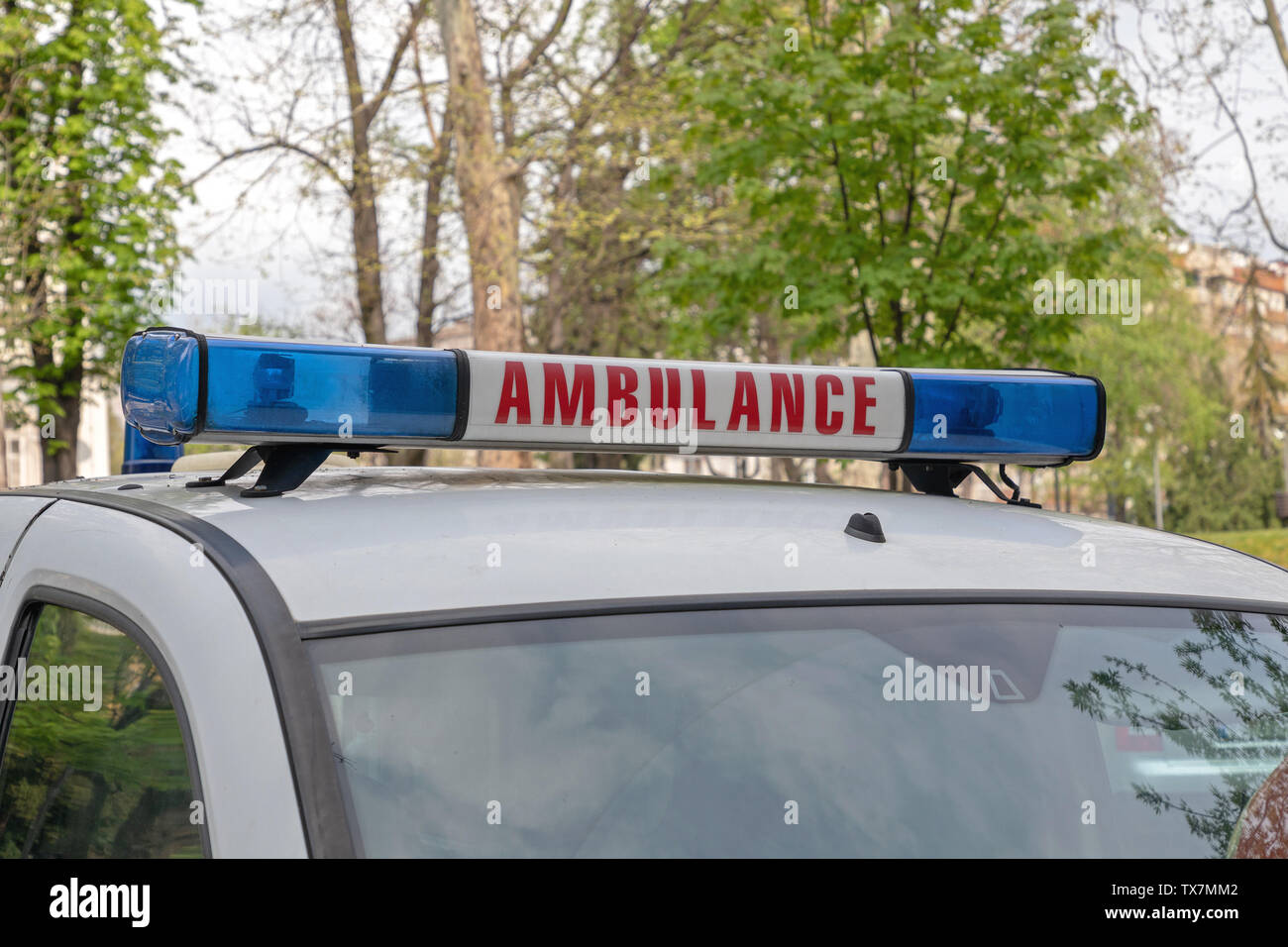 Ambulance Sign With Blue Lights Bar and Siren Stock Photo - Alamy