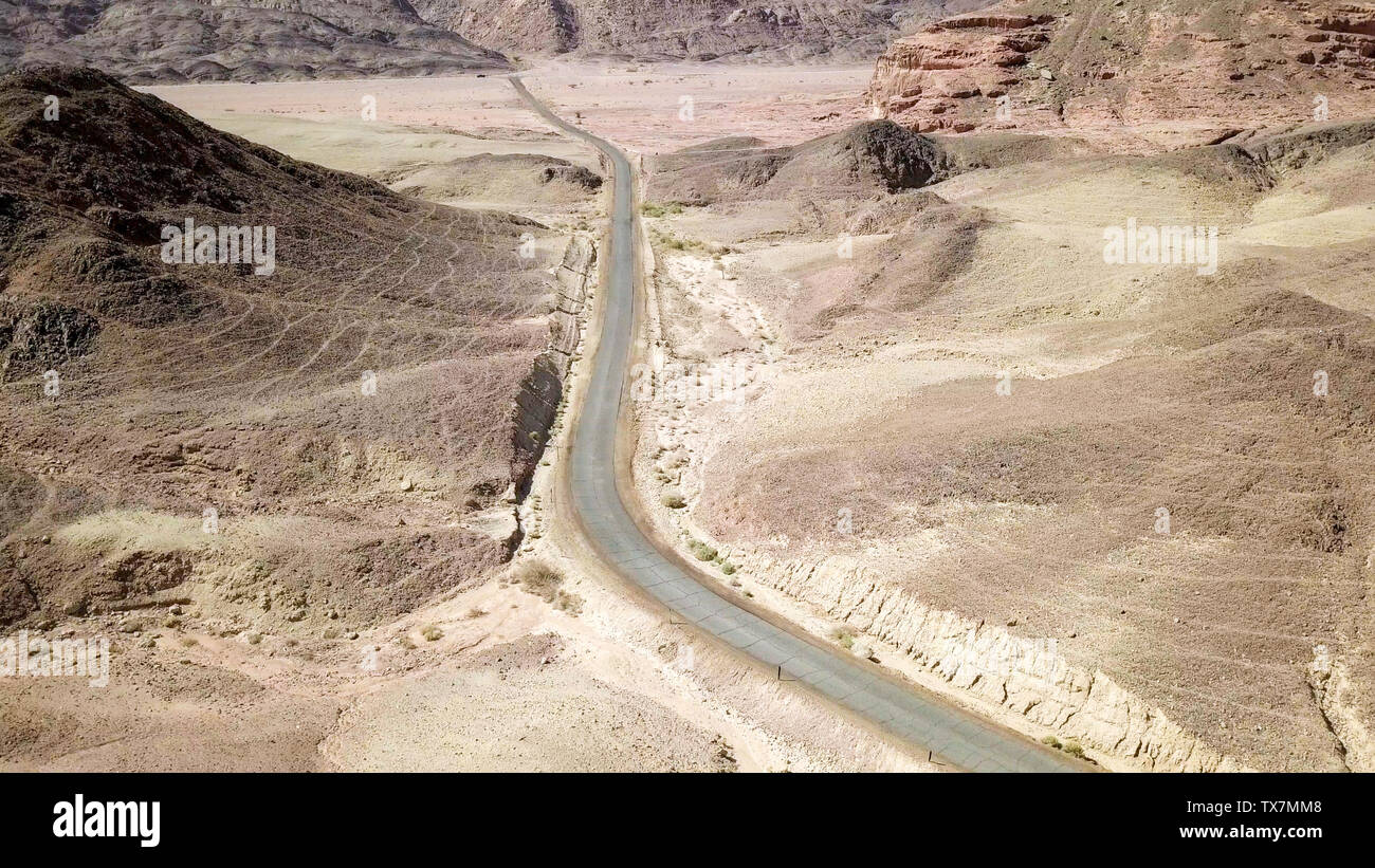 Old Desert road with cracked asphalt, Top down aerial image Stock Photo ...