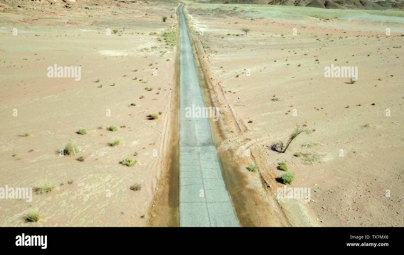 Old Desert road with cracked asphalt, Top down aerial image Stock Photo ...