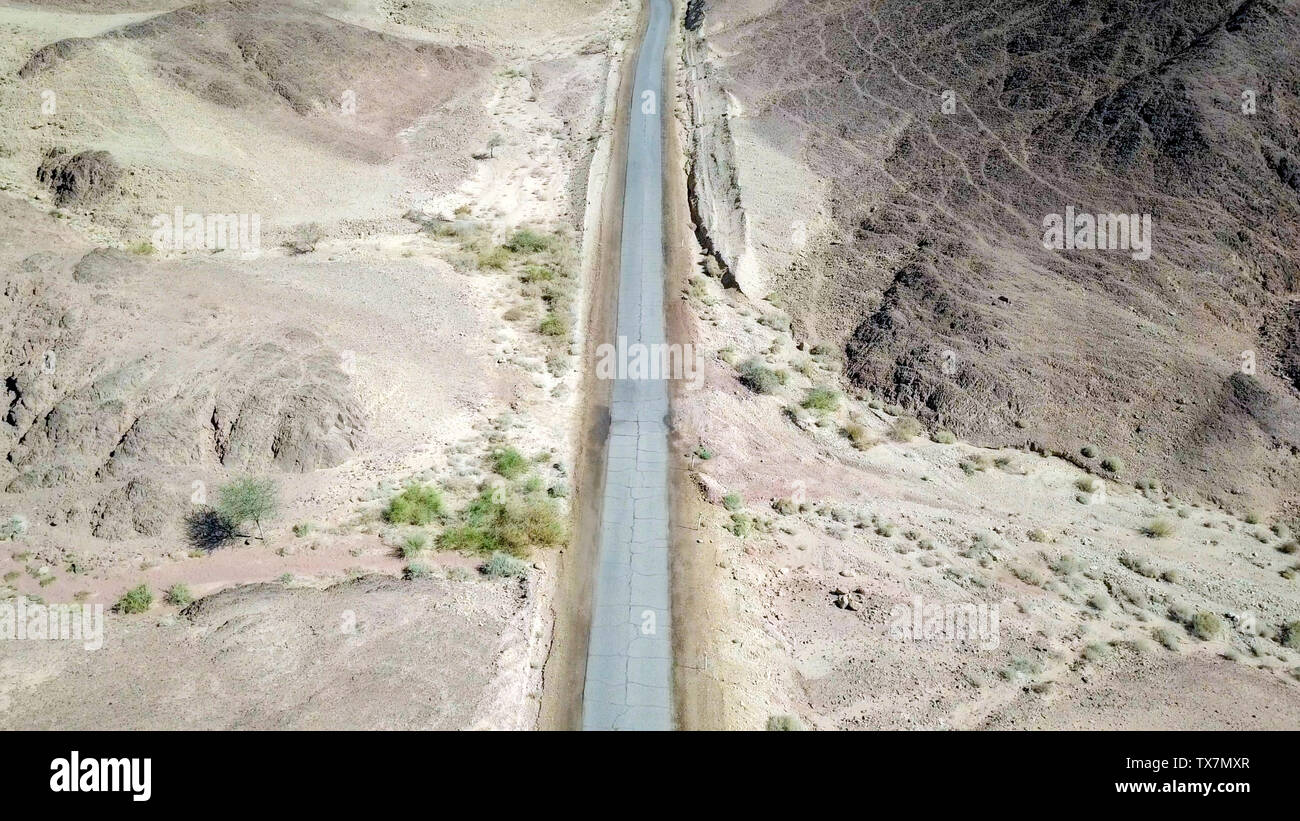 Old Desert road with cracked asphalt, Top down aerial image Stock Photo ...