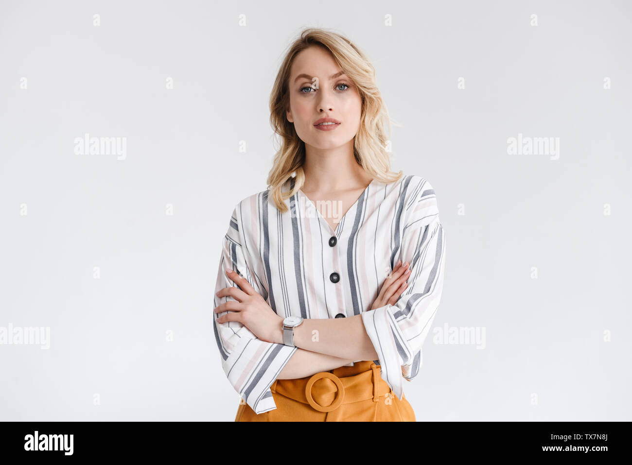Portrait of blond nice woman wearing casual clothes looking at camera ...