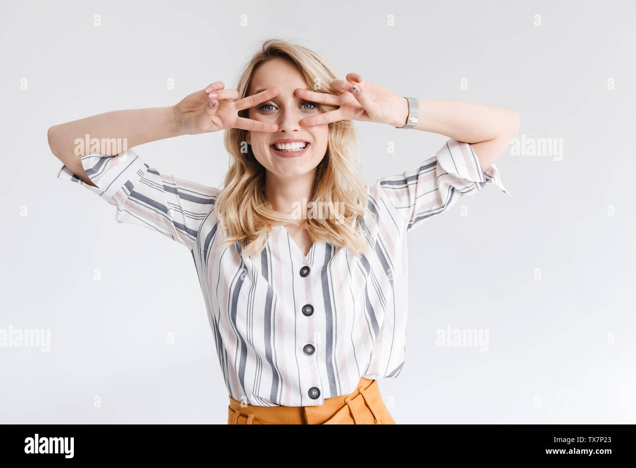 Portrait of pretty charming woman wearing casual clothes smiling and ...