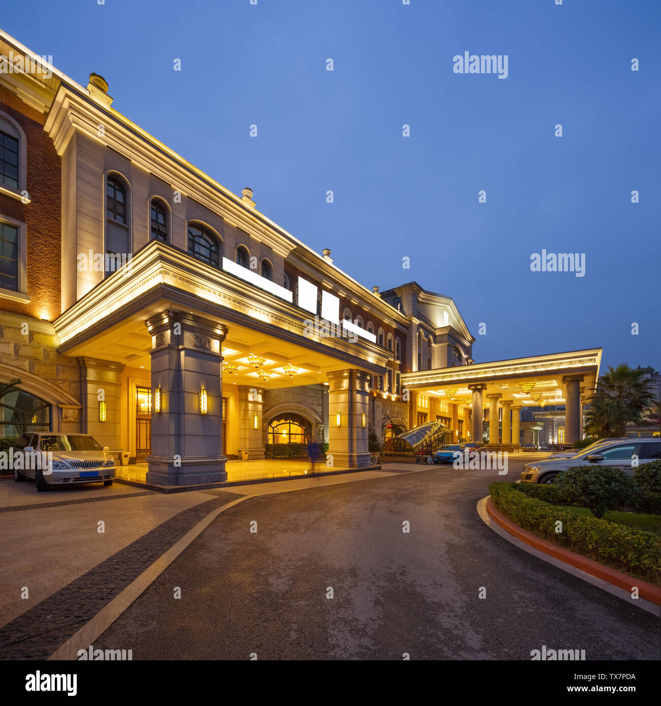 asphalt road front of luxury building in clear sky at night Stock Photo ...