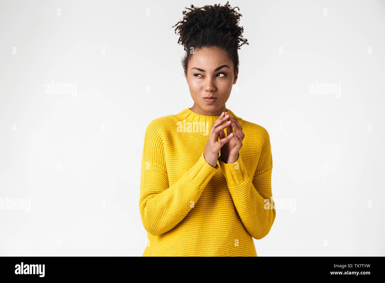 Image of a beautiful young african treacherous woman posing isolated ...