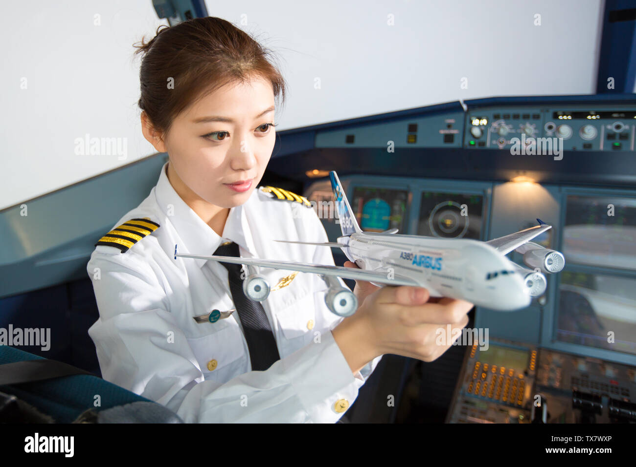 Asian female pilot hi-res stock photography and images - Alamy
