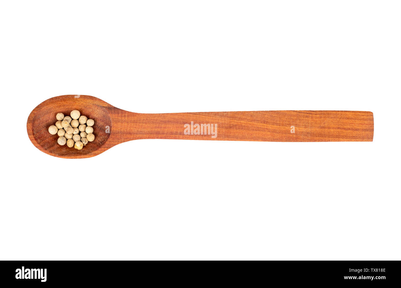 White pepper peas in wooden spoon on white background, top view Stock ...