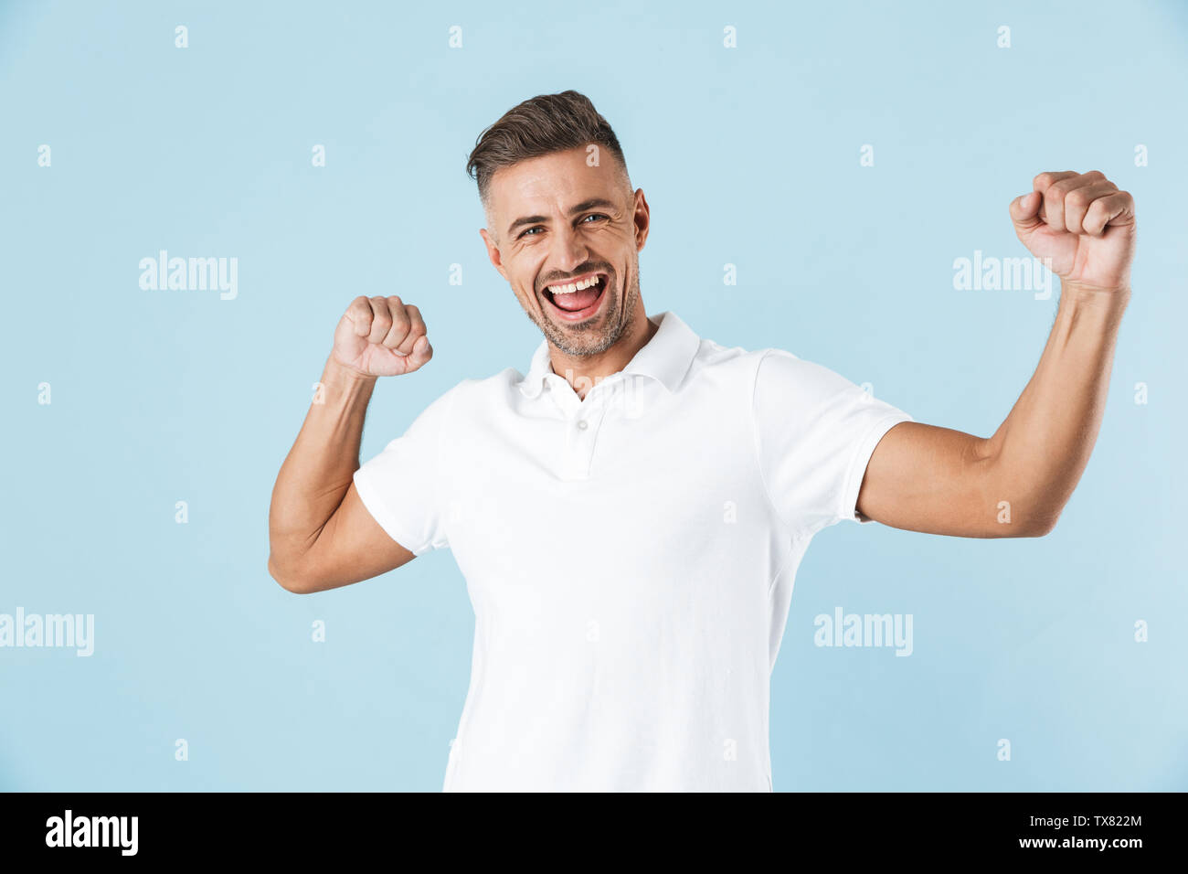 Image of a handsome excited emotional adult man posing isolated over ...