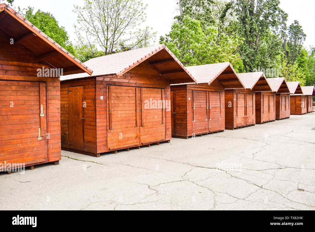 Closed and locked wooden kiosk in the city downtown. Wooden stands ...