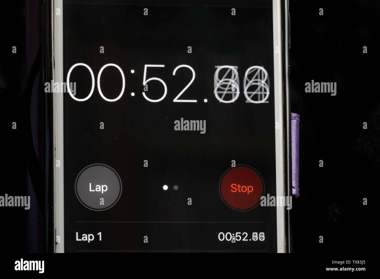Stop clock on a smart phone showing the time passing at 52 seconds ...