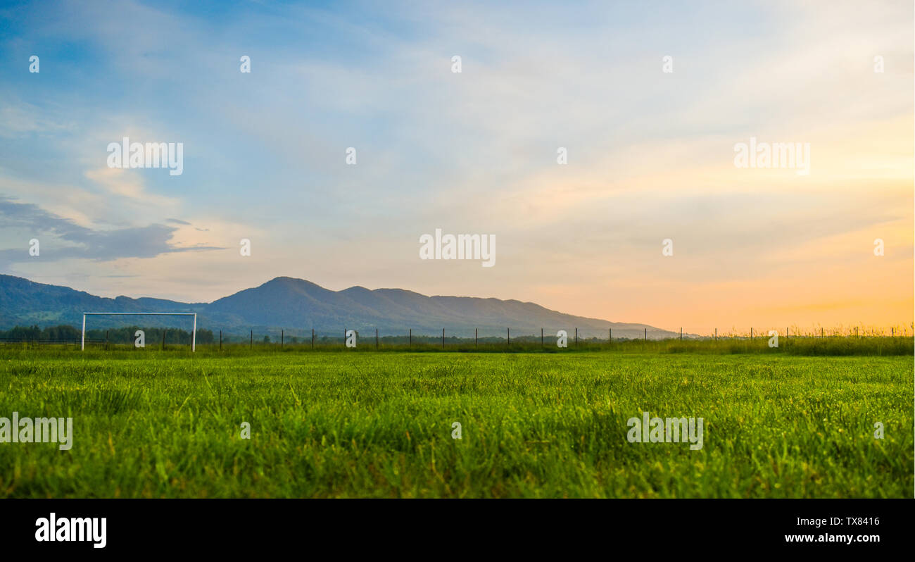 Improvissed football field in the nature with green grass and beautiful ...