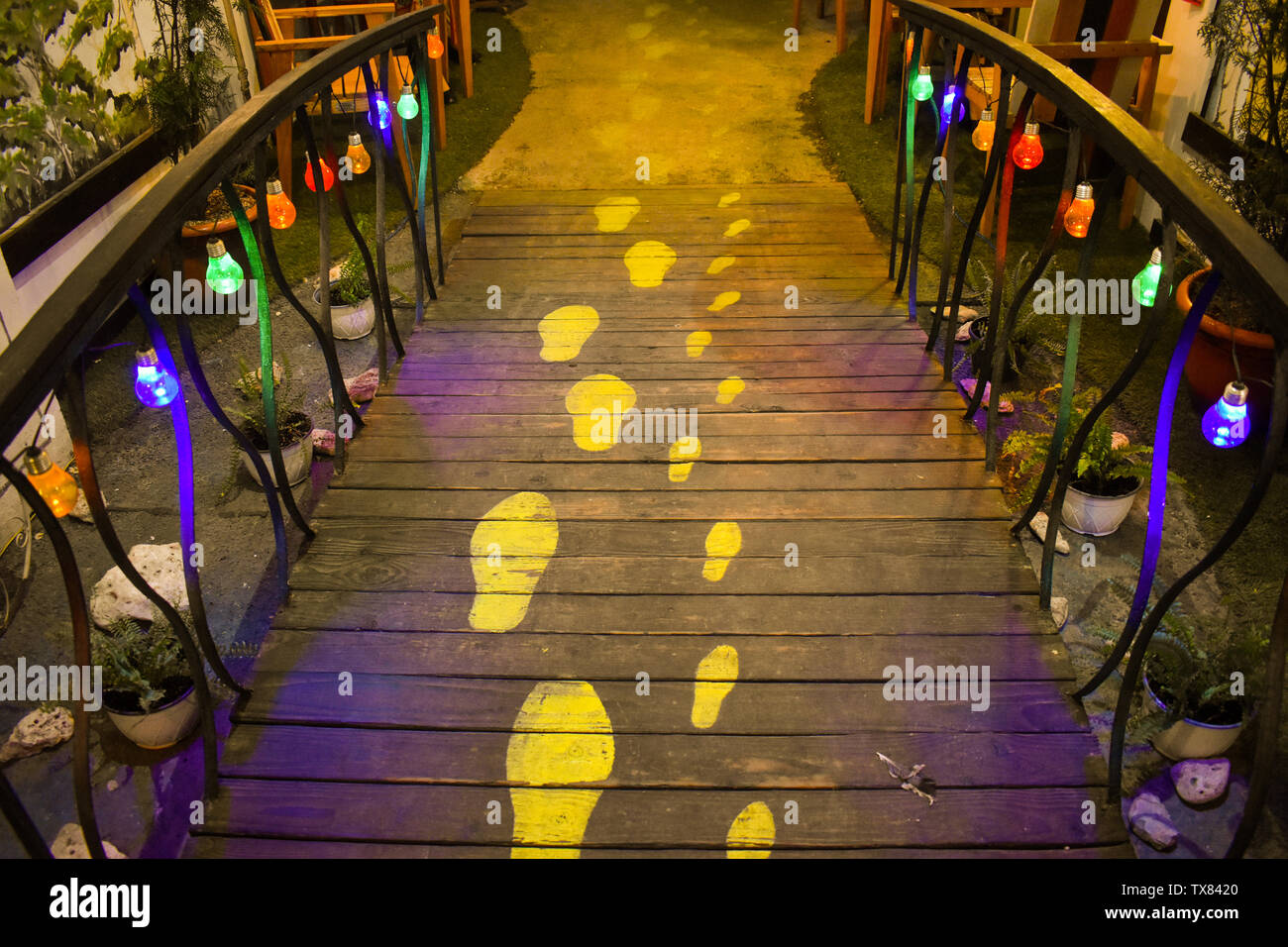 Innovative idea of human foot traces on the wooden pathway with ...