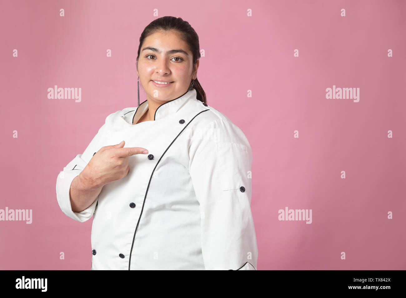 Chef woman with challenge and authority gesture with her stainless ...