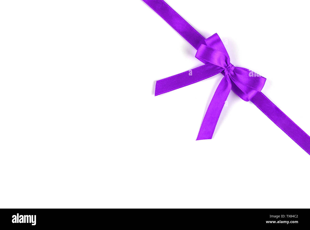 Shiny purple silk ribbon on white background Stock Photo - Alamy