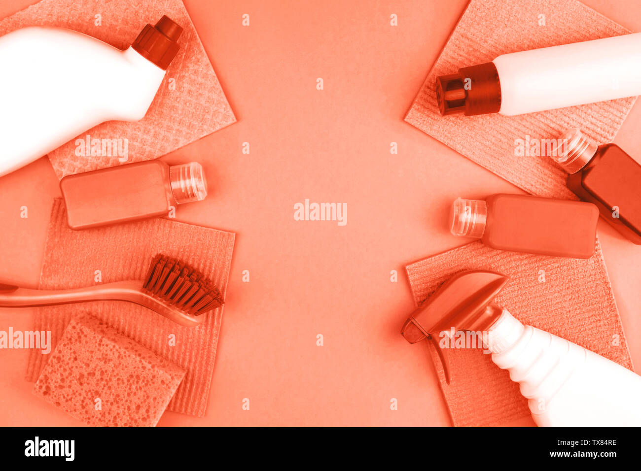 House cleaning products are on coral background Stock Photo - Alamy