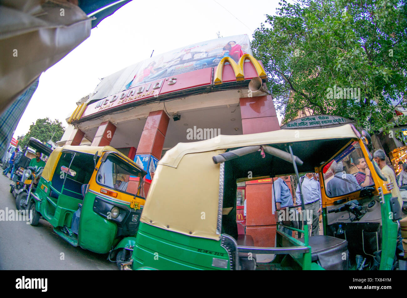 fisheye shot of chandni chowk with auto and electric rickshaw and fast ...
