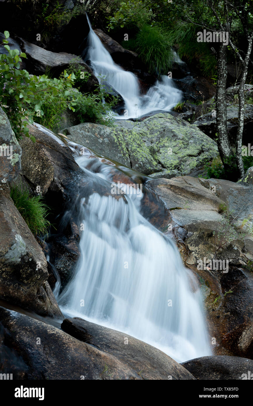 Beautiful waterfall falling on the stones Stock Photo - Alamy