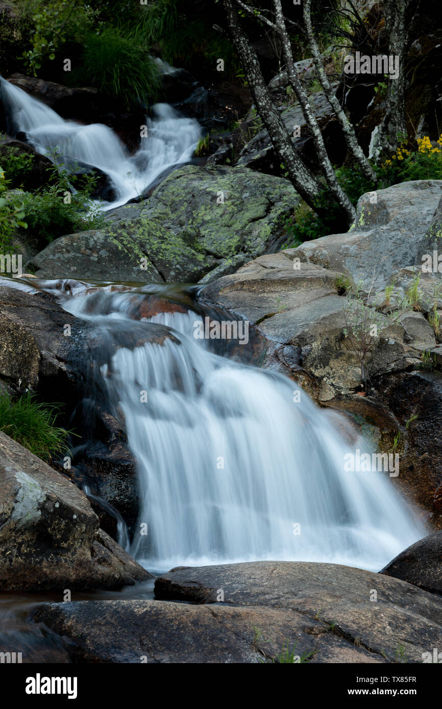 Beautiful waterfall falling on the stones Stock Photo - Alamy