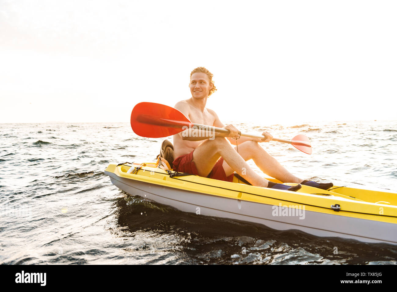Healthy fit man on a kayak at the sea Stock Photo - Alamy