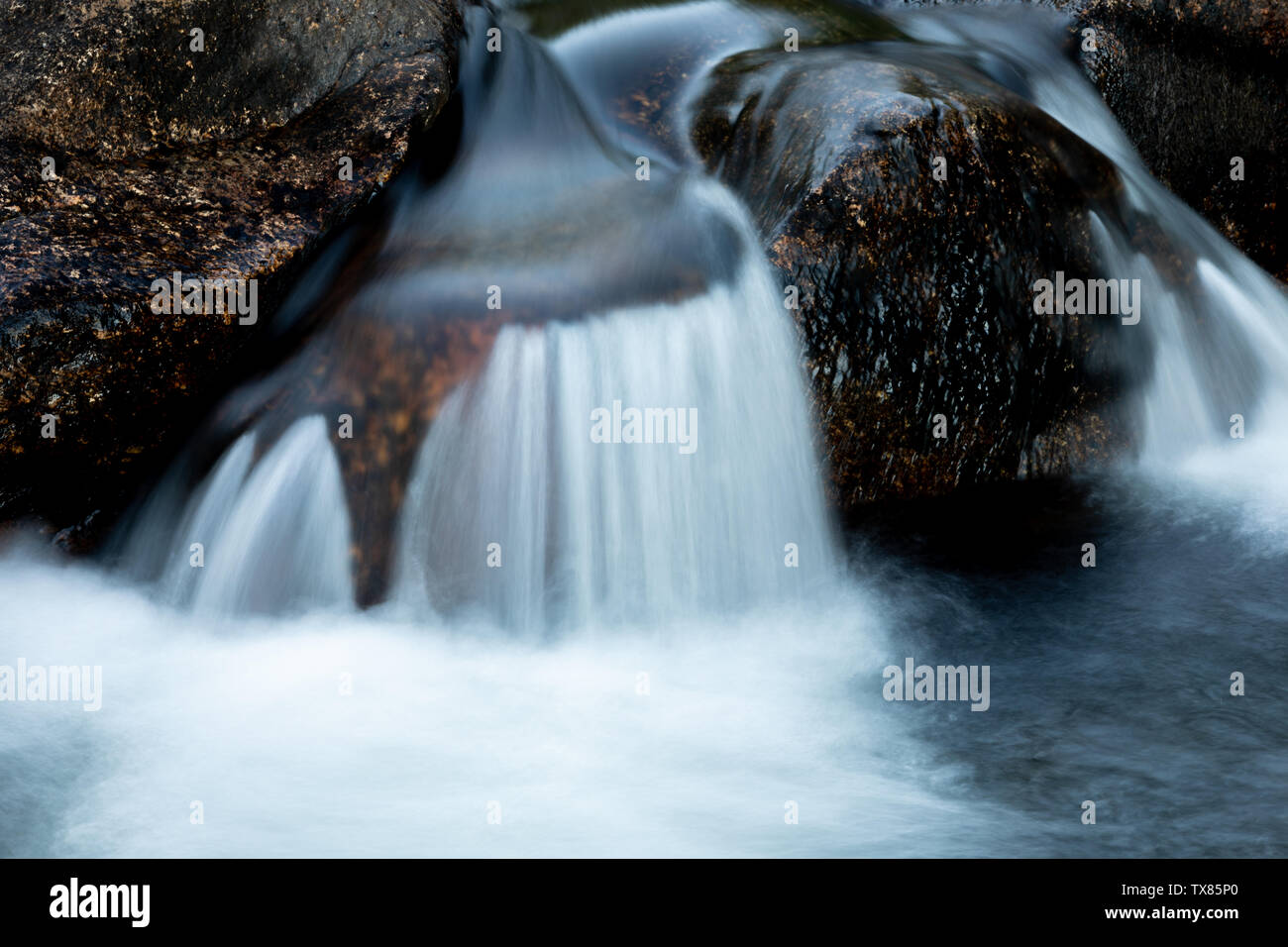 Beautiful waterfall falling on the stones Stock Photo - Alamy